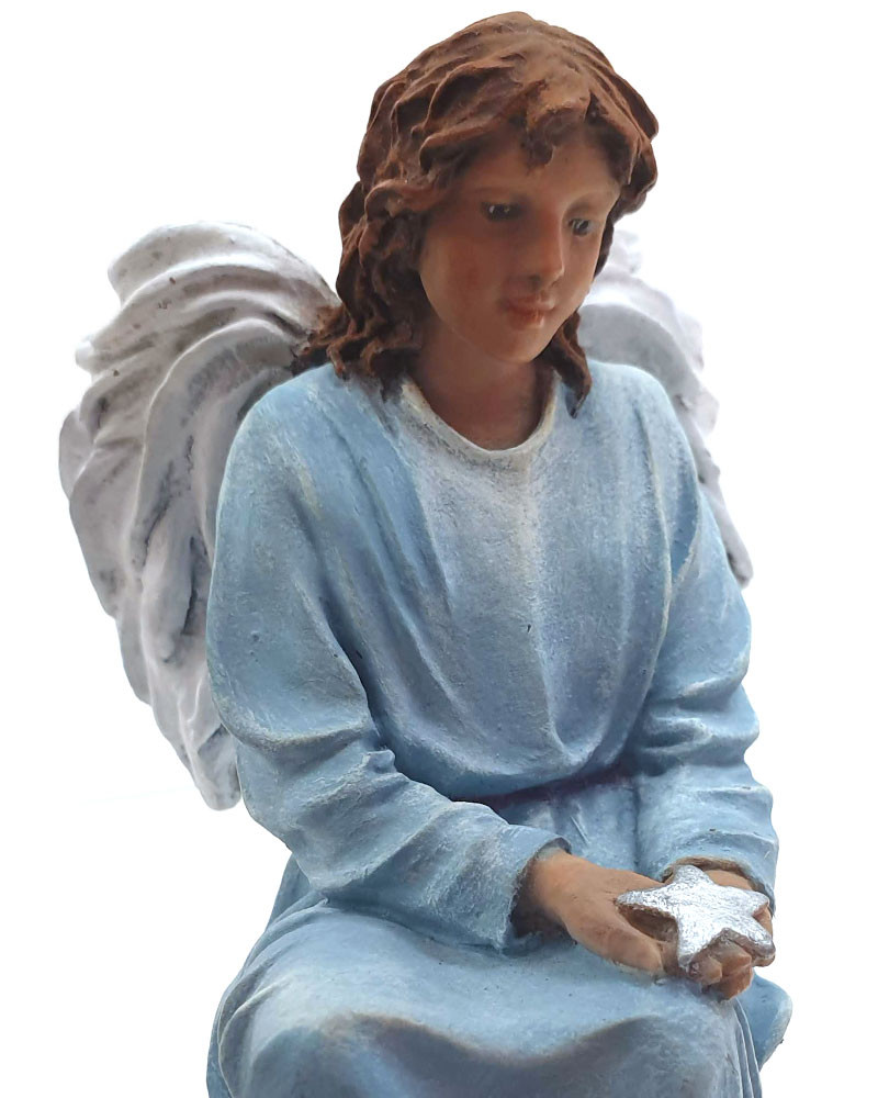 Angel sentado con una estrella
