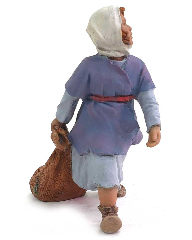 Girl dragging a sack