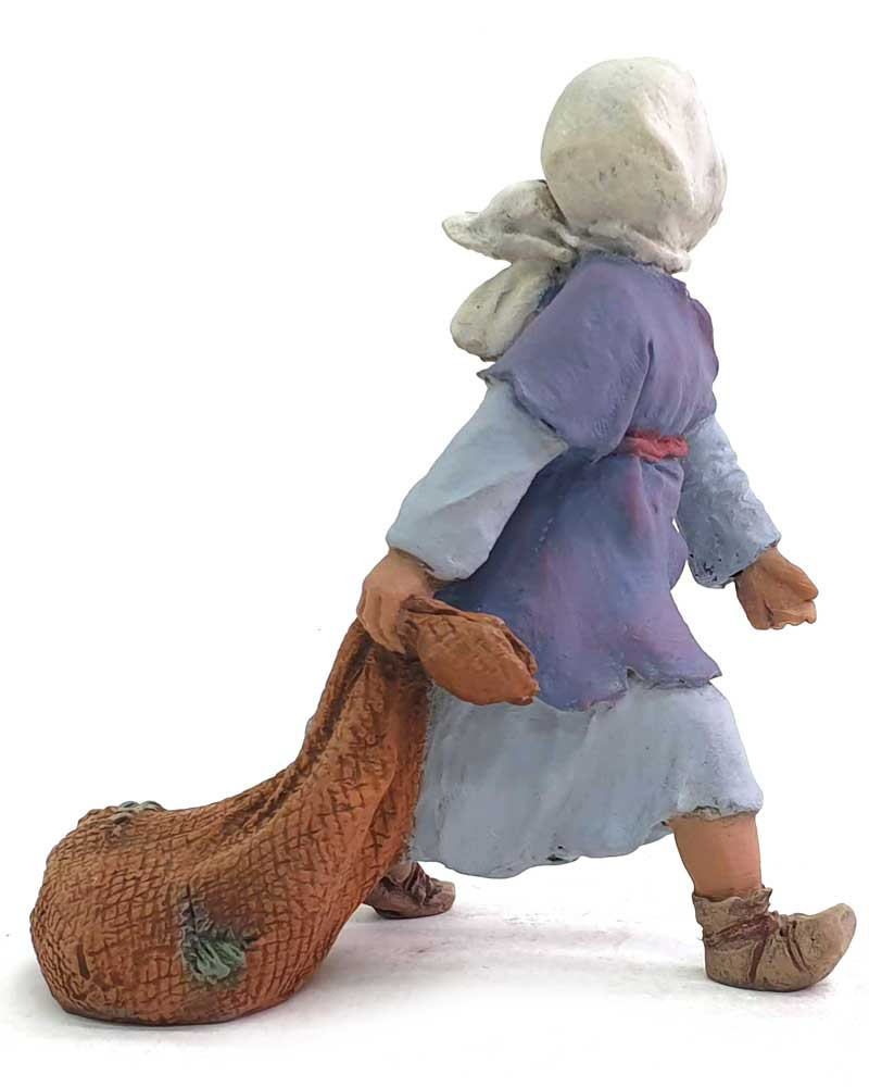 Girl dragging a sack