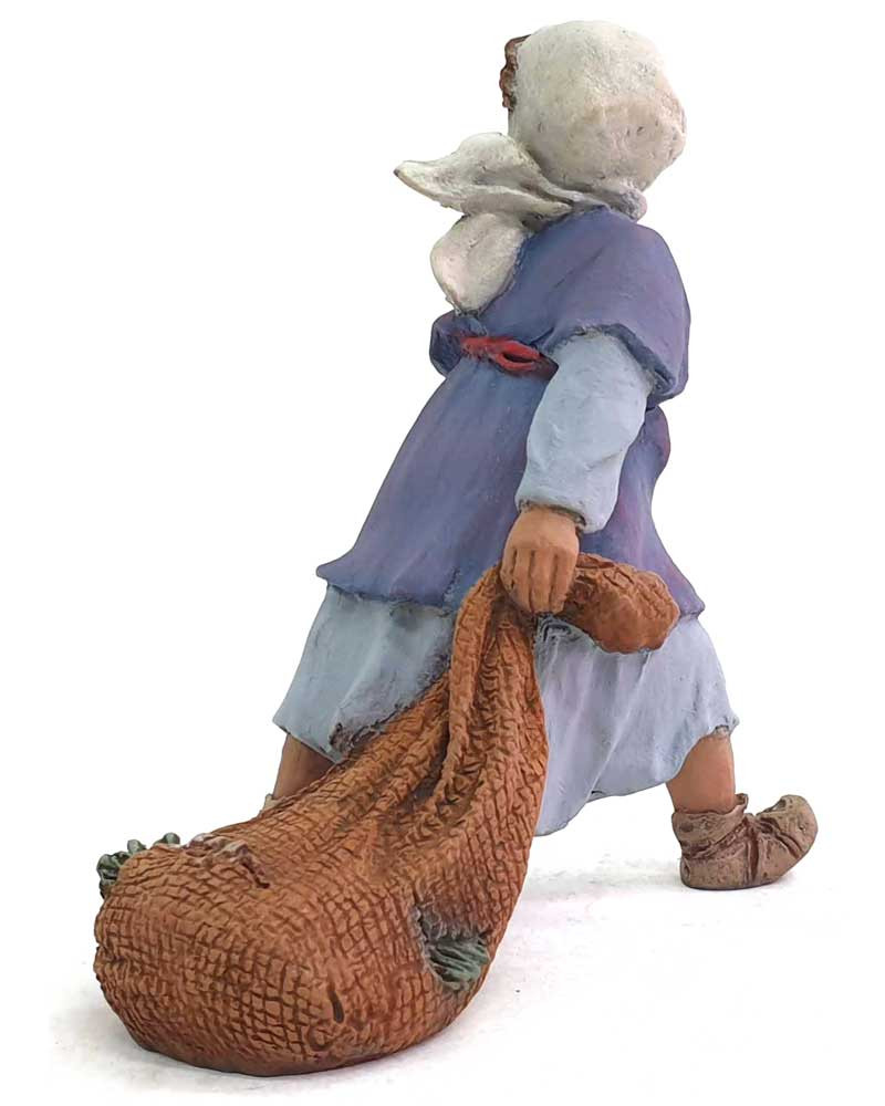 Girl dragging a sack